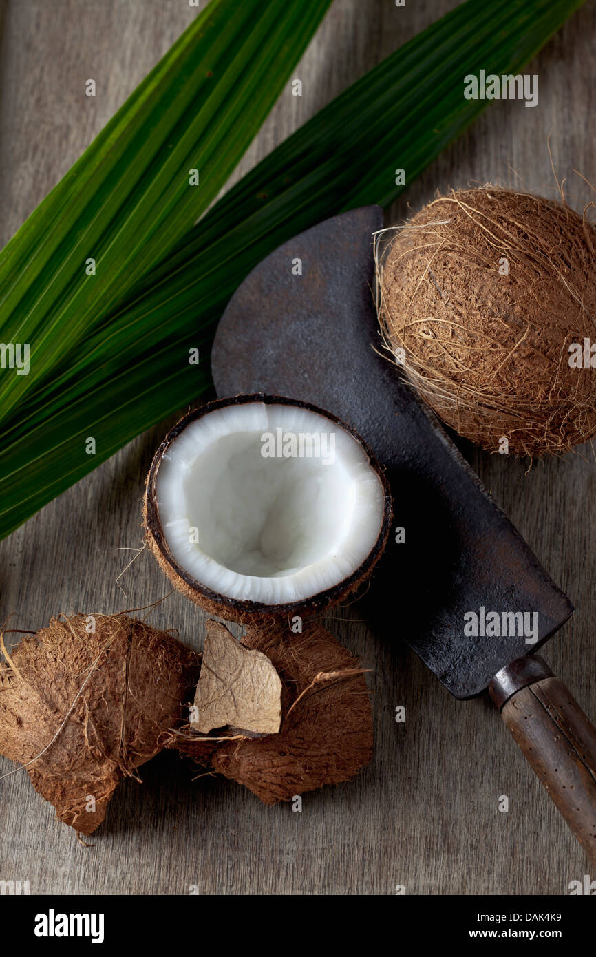 Coconuts with sickle, close up Stock Photo - Alamy