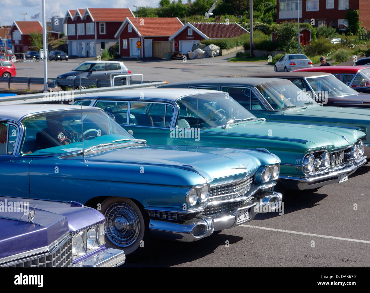 Classic cars parked in line on a car park Stock Photo - Alamy