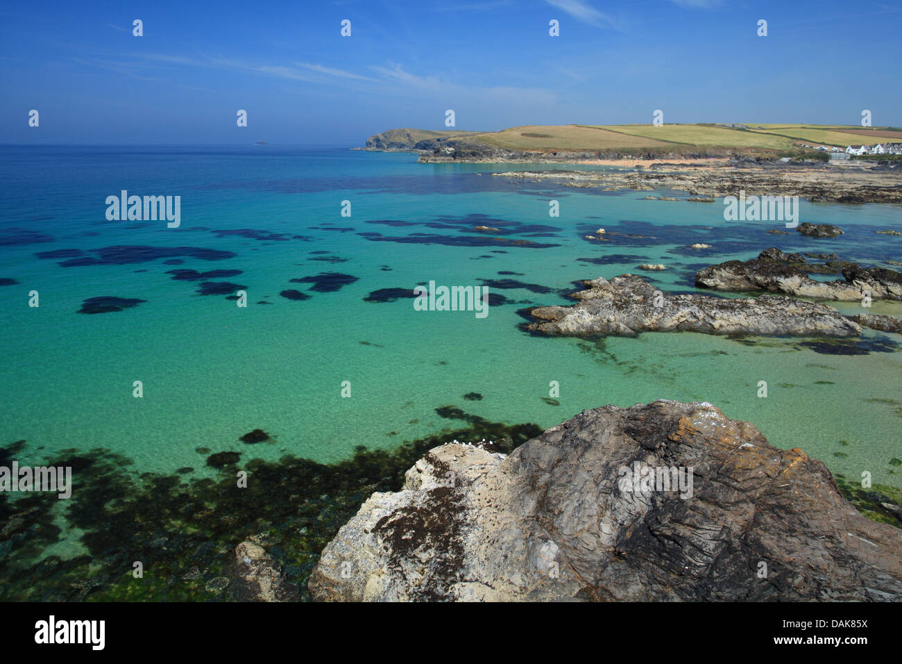 Flat calm sea, view across Newtrain Bay towards Trevone Bay, North ...