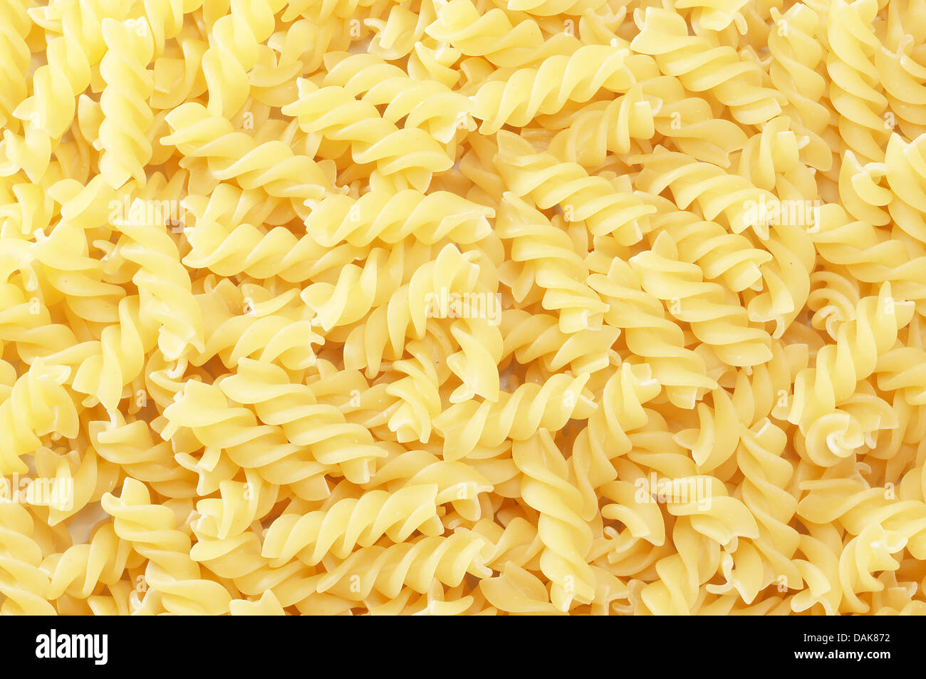 background with close up of spiral fusilli pasta Stock Photo - Alamy