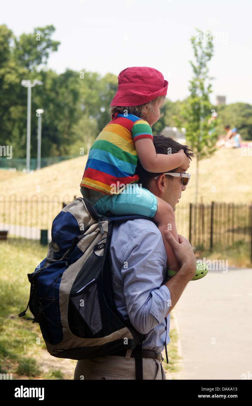 Child is on Father's shoulder Stock Photo - Alamy