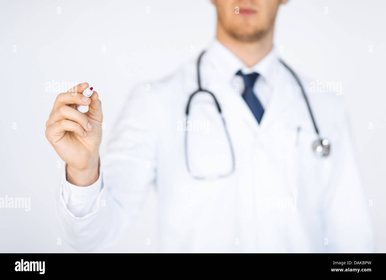 doctor writing something in the air Stock Photo - Alamy