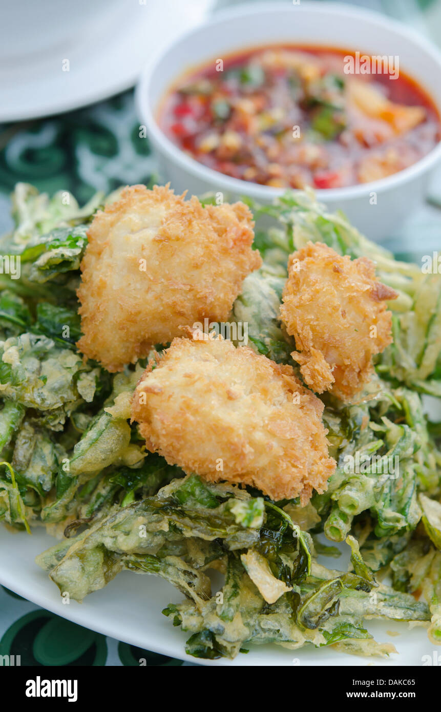 close up crispy shrimp and crispy vegetable served with red chili sauce ...