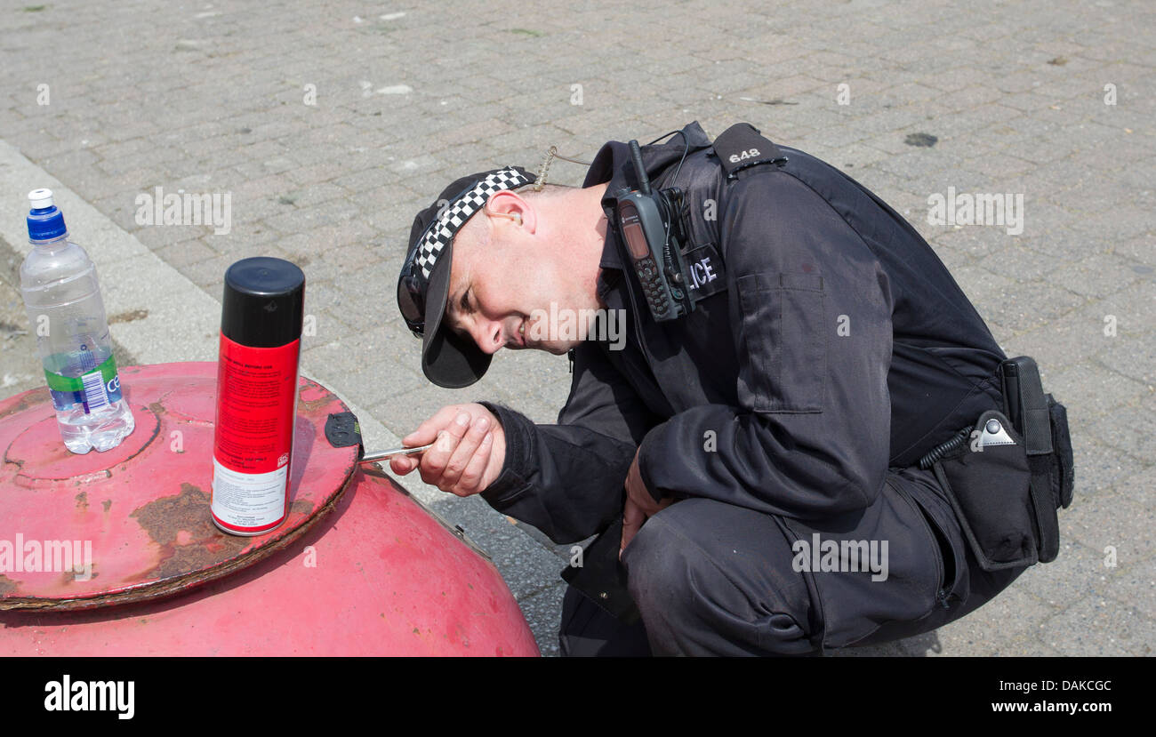 Police security officers checking for bombs - explosives in old WW2 ...