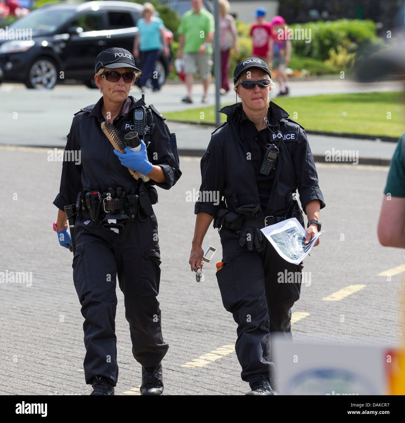 Police security female officers checking for bombs - explosives before ...