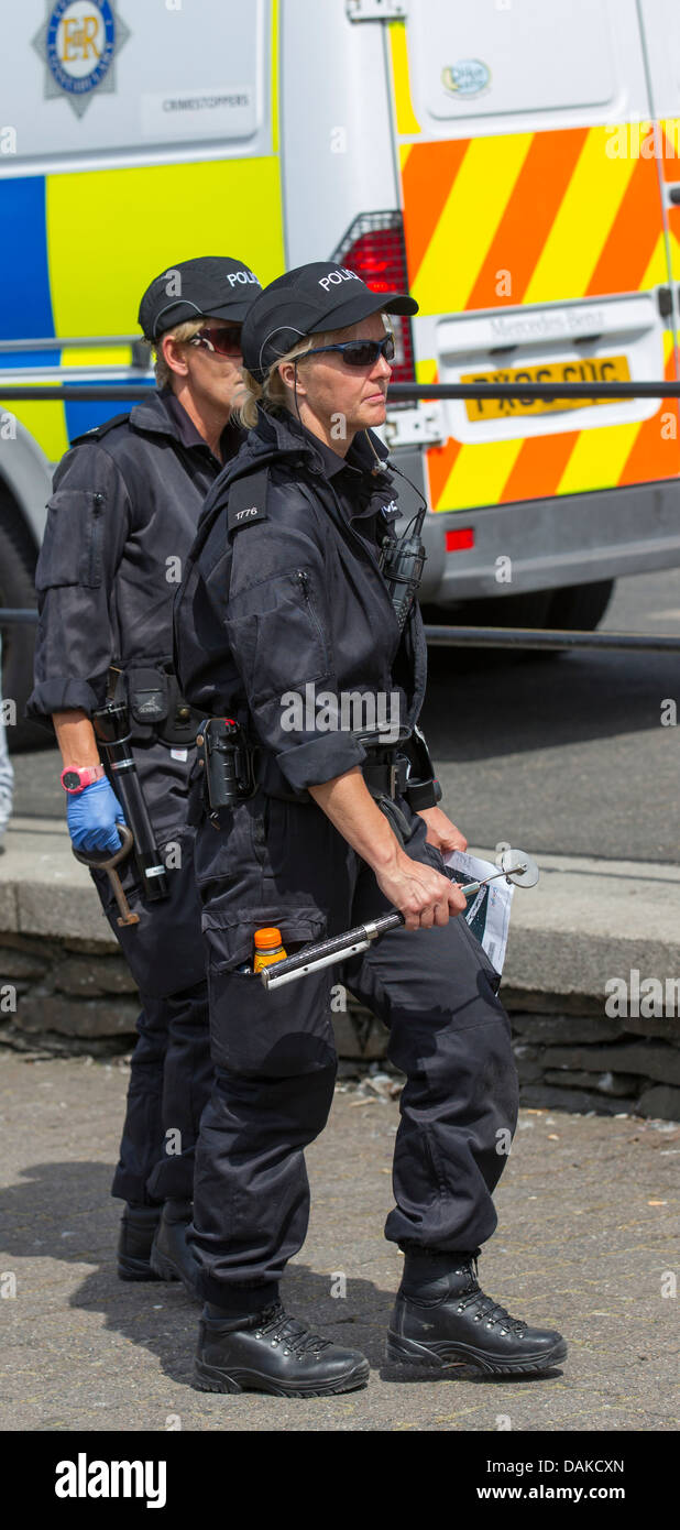 Police security female officers checking for bombs - explosives before ...