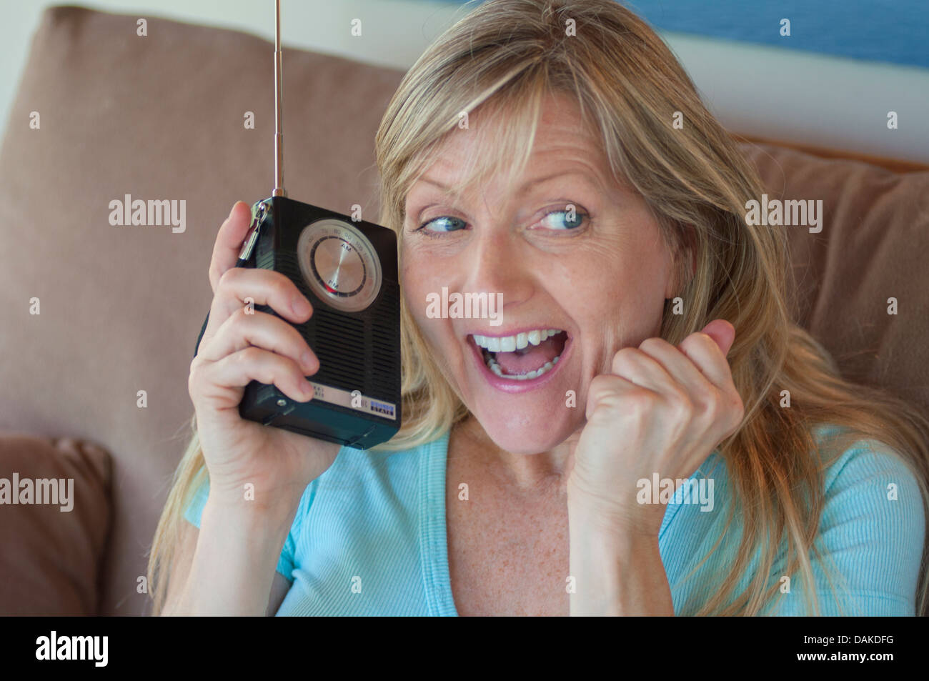 Person listening to transistor radio hi-res stock photography and ...