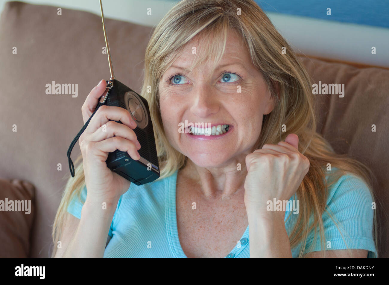 Person listening to transistor radio hi-res stock photography and ...