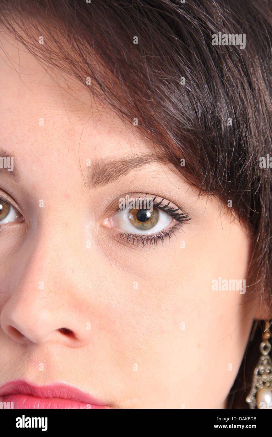 Focus on an eye in a beautiful young face Stock Photo - Alamy