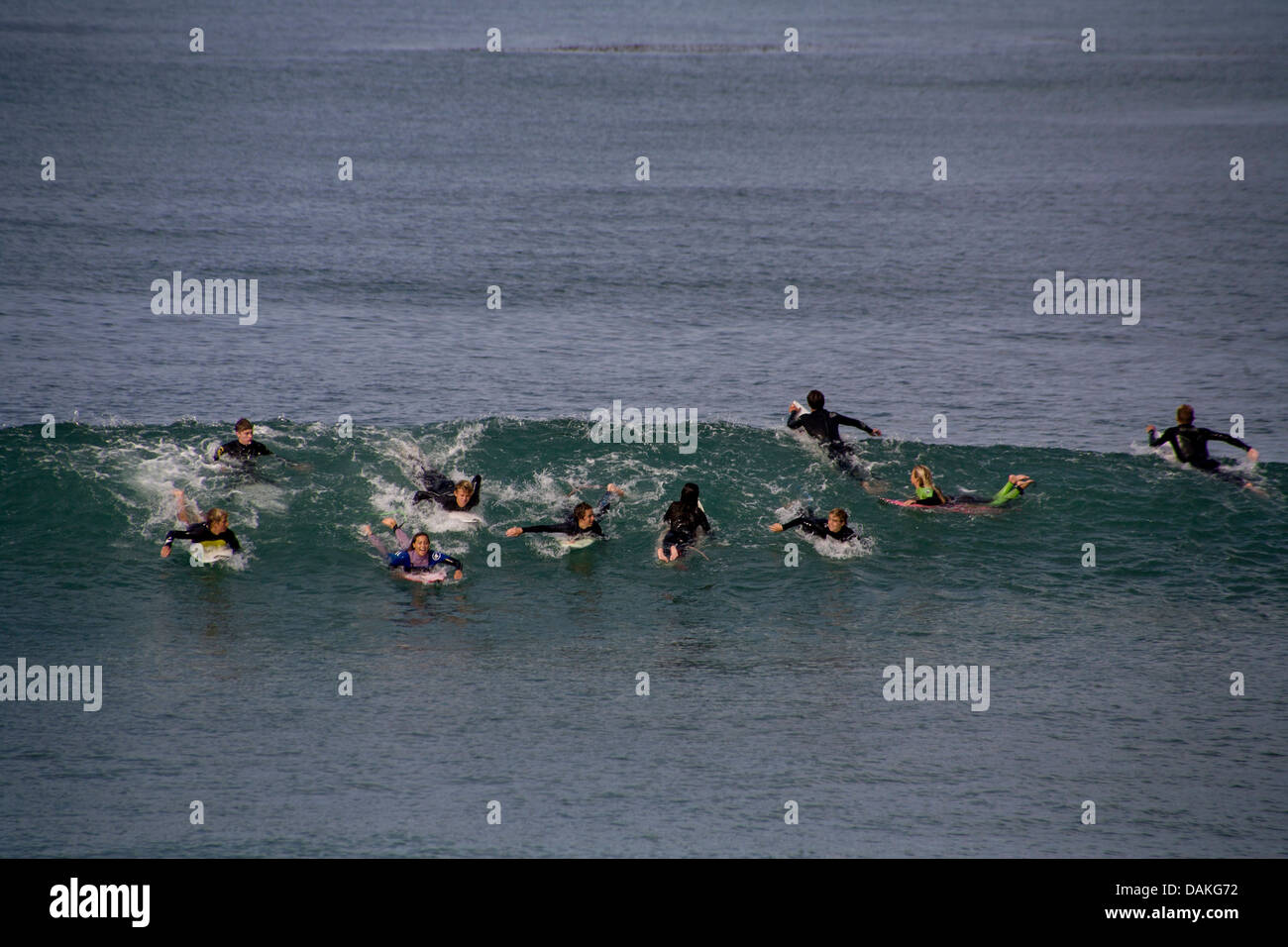 Teen boy and girl members of the San Clemente, CA, High School surfing ...