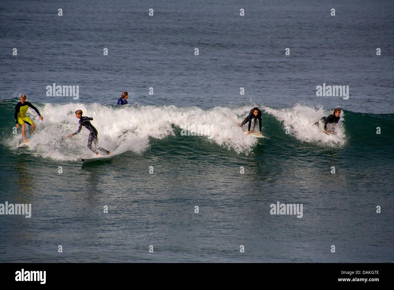 Teen boy and girl members of the San Clemente, CA, High School surfing ...