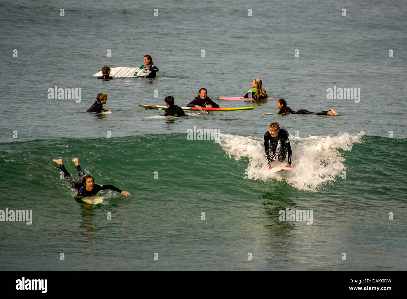 Teen boy and girl members of the San Clemente, CA, High School surfing ...