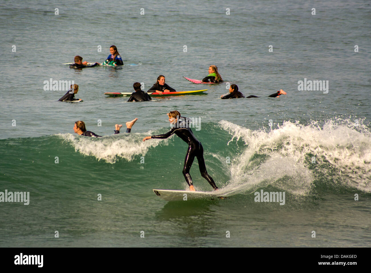 Teen boy and girl members of the San Clemente, CA, High School surfing ...