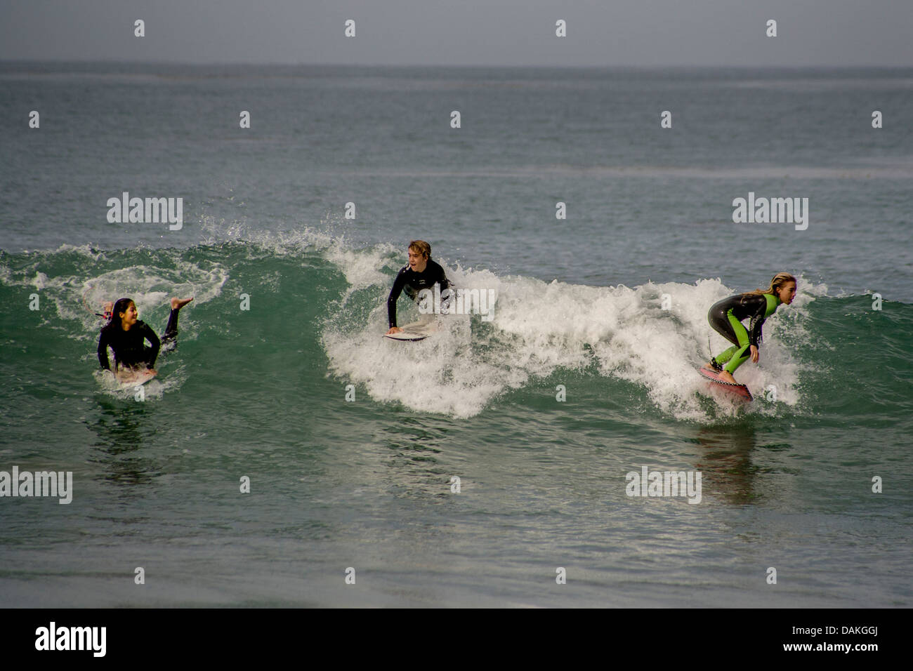 Teen boy and girl members of the San Clemente, CA, High School surfing ...