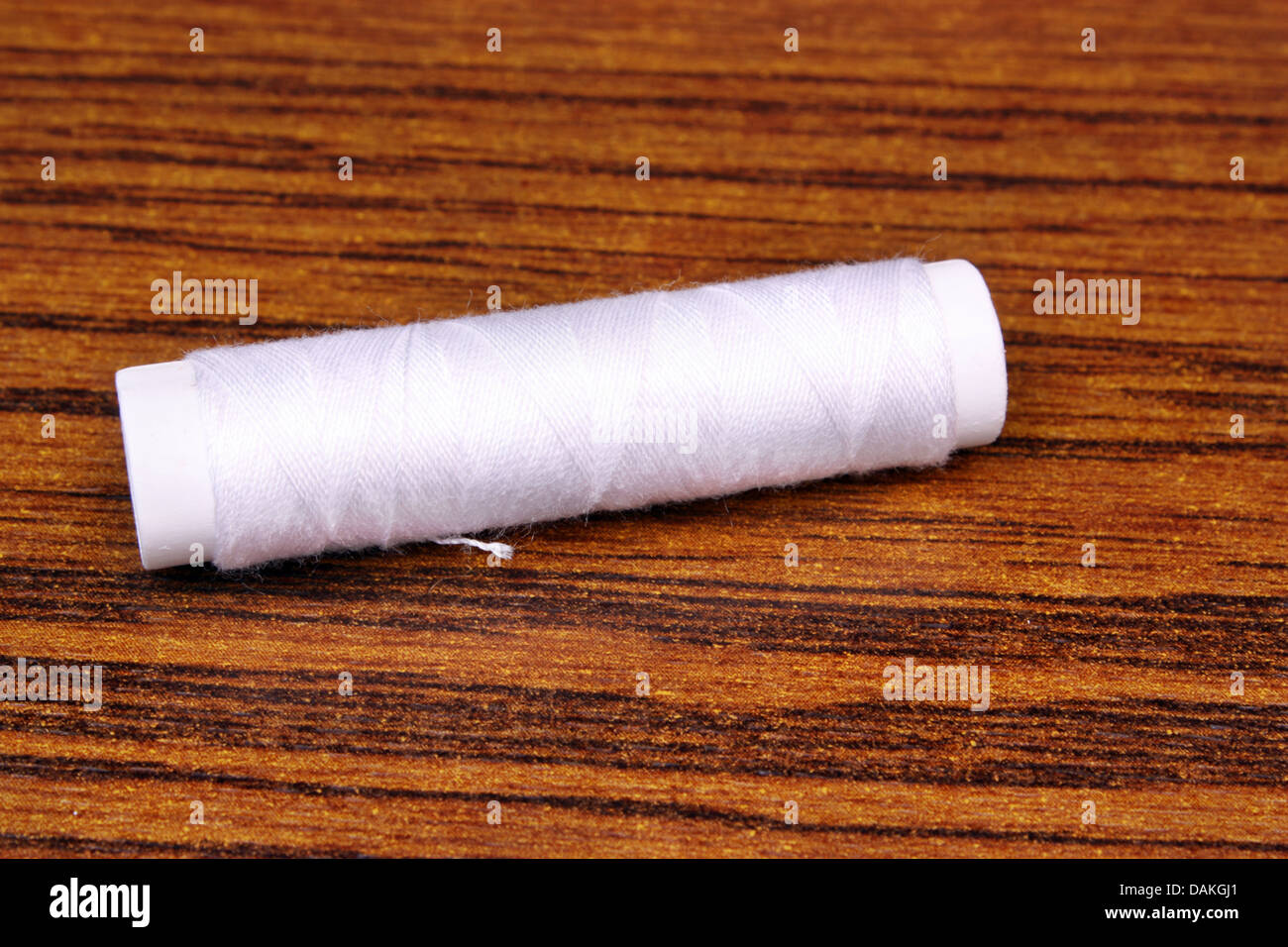 White sewing thread Stock Photo - Alamy