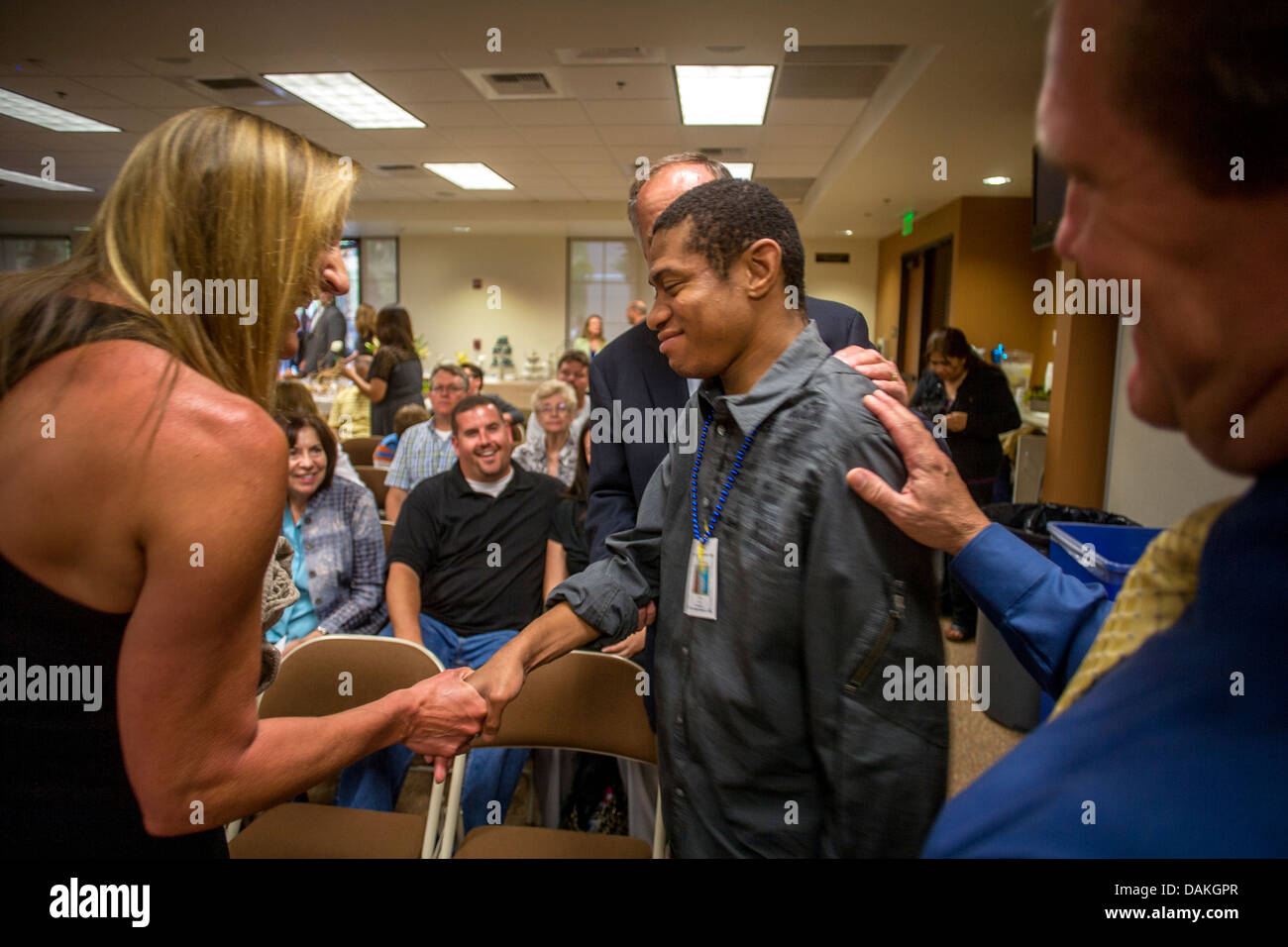 A handicapped Adult Transition Program (ATP) student is welcomed by ...