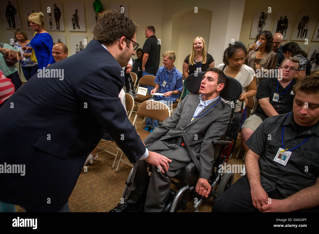 A wheelchair-bound Adult Transition Program (ATP) student is welcomed ...