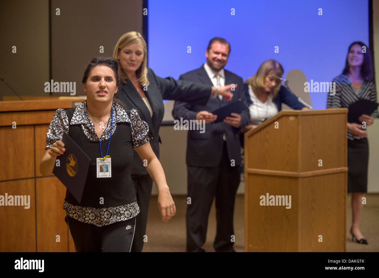 An Adult Transition Program (ATP) student receives her diploma at ...