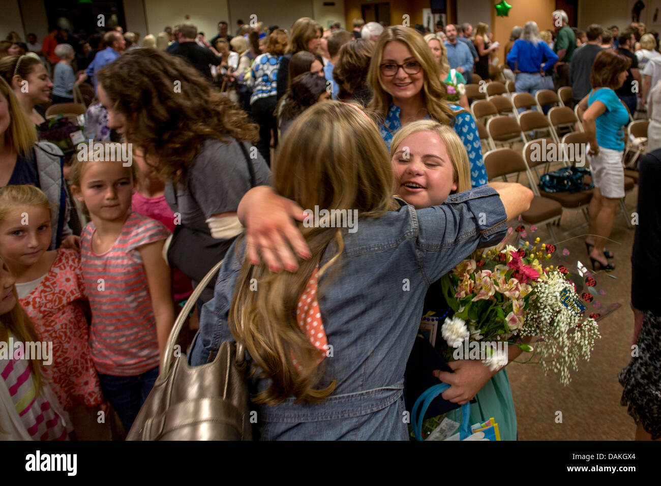 A handicapped Adult Transition Program (ATP) student is congratulated ...
