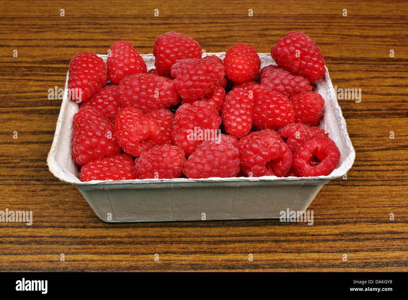 Raspberries in baskets on the table Stock Photo - Alamy