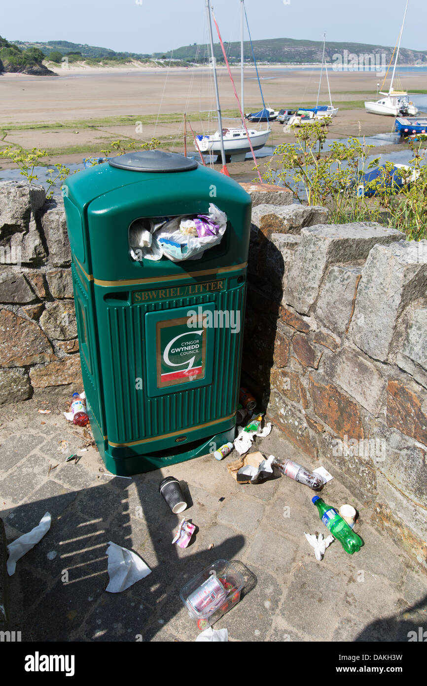 Village of Abersoch, Wales. A local council refuse bin overflowing with ...