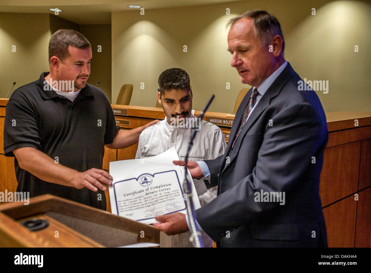 A happy graduate receives a special award at his Adult Transition ...