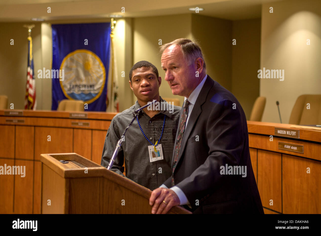 A happy graduate receives a special award at his Adult Transition ...