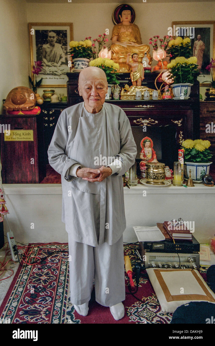 A Vietnamese Buddhist priest poses in his makeshift temple located in a ...