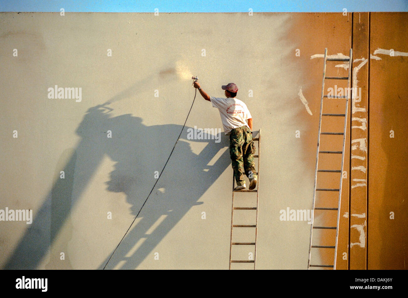 Someone Spray Painting A Wall