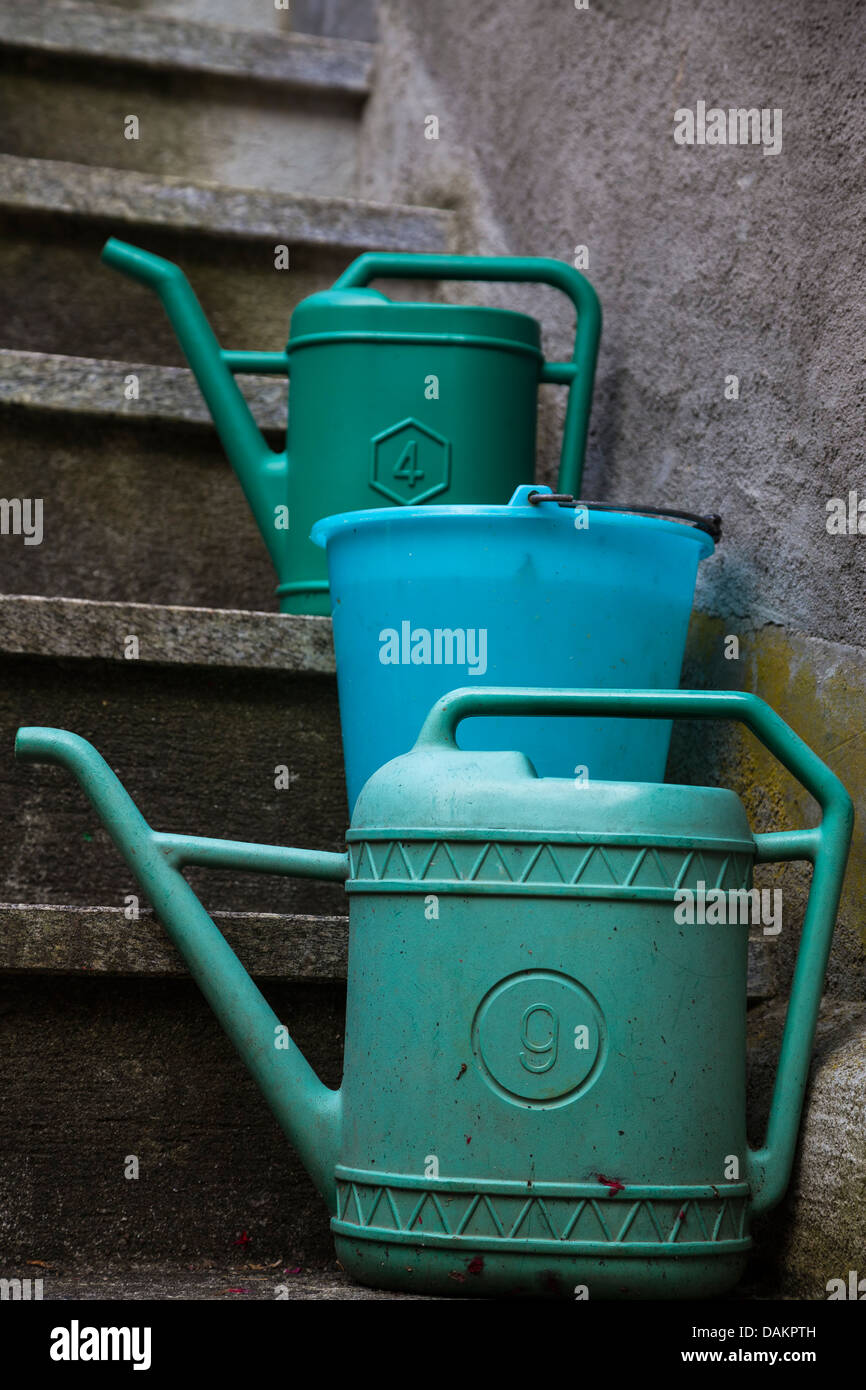 Watering cans and bucket Stock Photo - Alamy