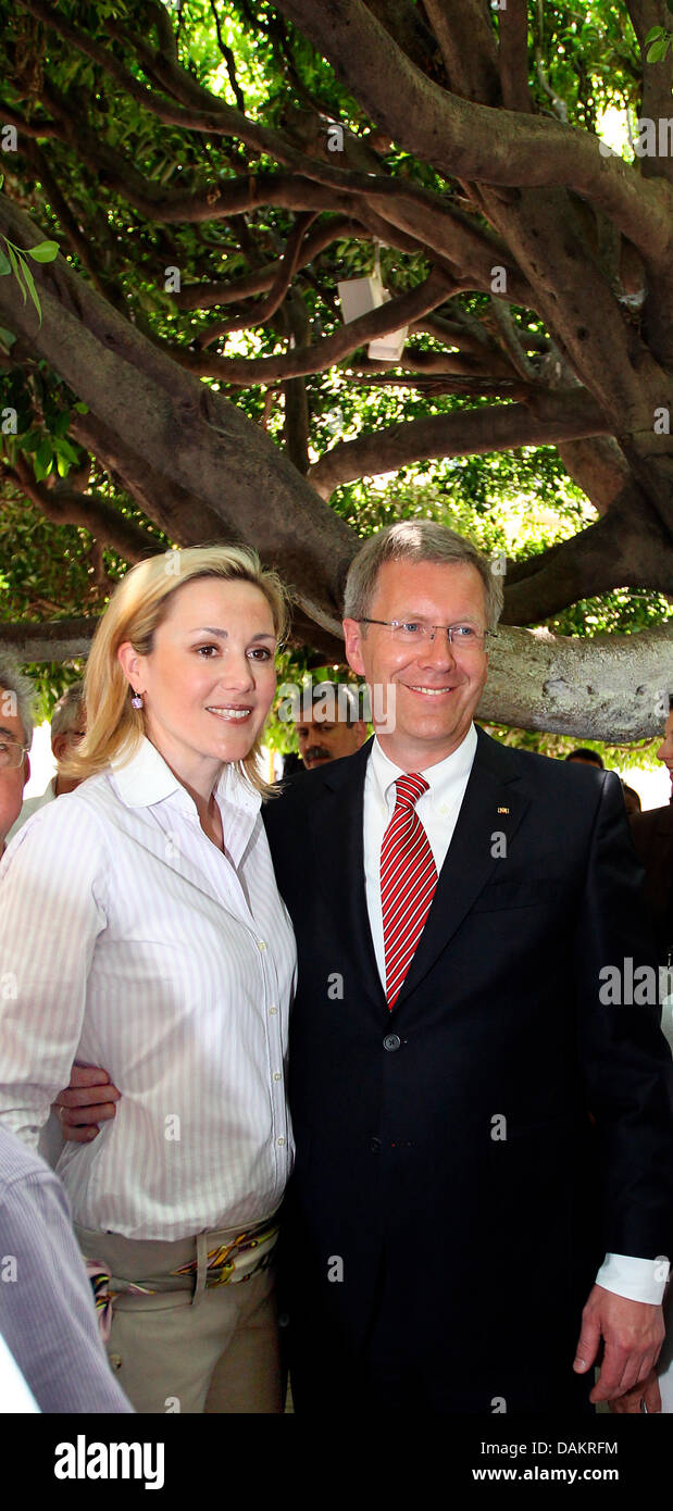 German president Christian Wulff and his wife Bettina stand underneath ...