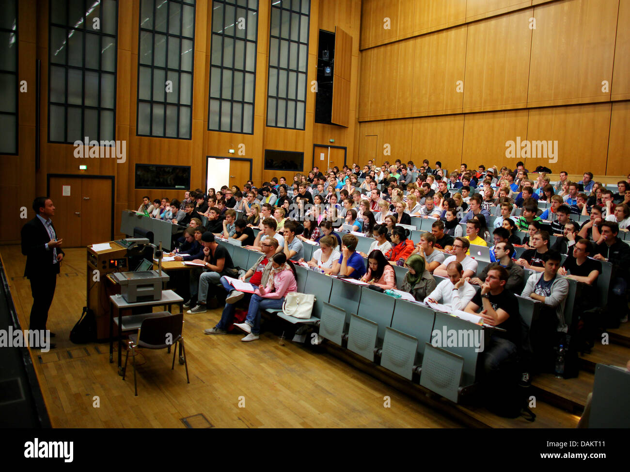 Students attend a lecture at a lecture hall of the university in ...