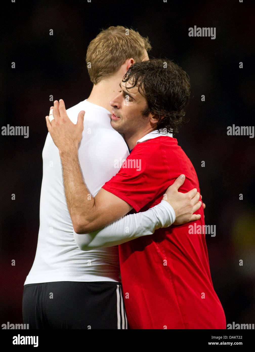 Schalke's goalkeeper Manuel Neuer (L) and Raul hug each other after the ...