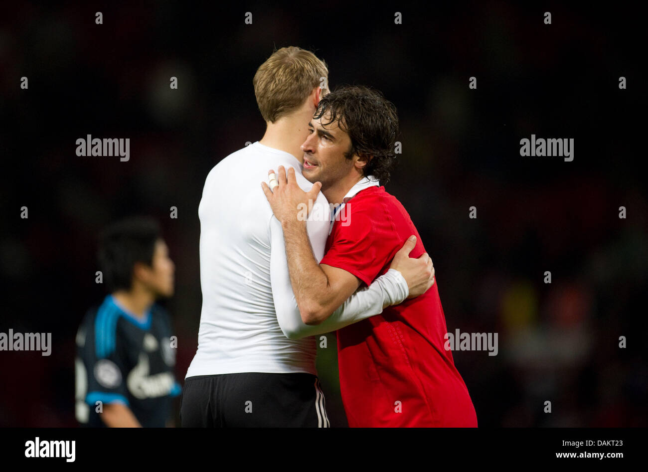 Schalke's goalkeeper Manuel Neuer (L) and Raul hug each other after the ...