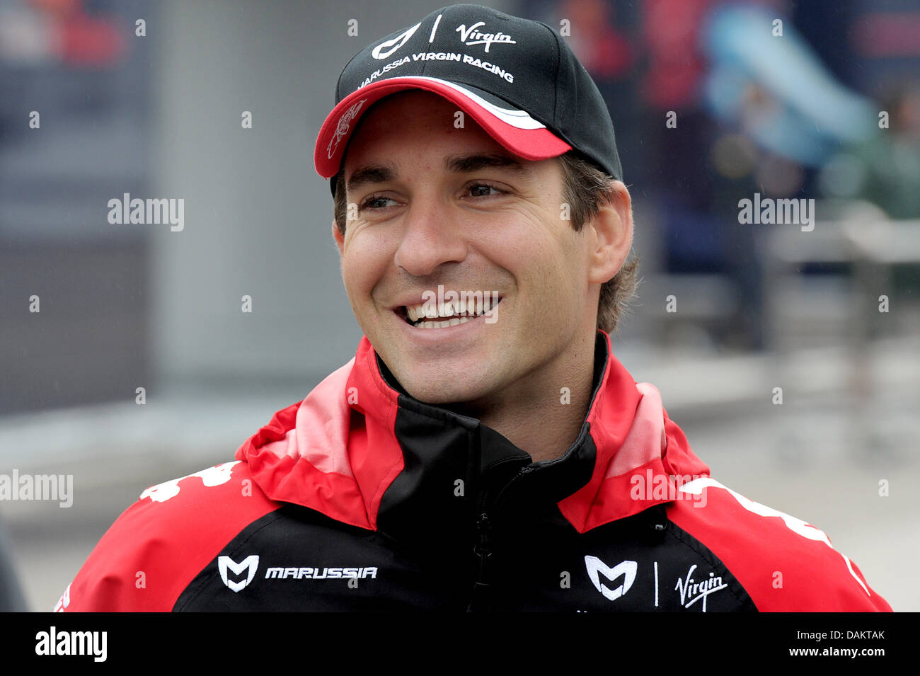 German Formula One driver Timo Glock of Virgin smiles in the paddock at ...