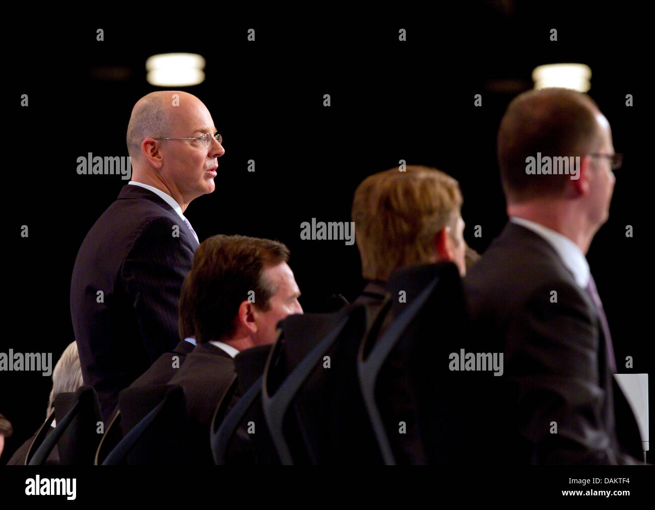 Commerzbank CEO Martin Blessing (L) speaks during the bank's general ...