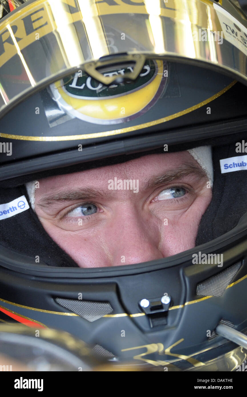 German Formula One driver Nick Heidfeld of Lotus Renault sits in his ...