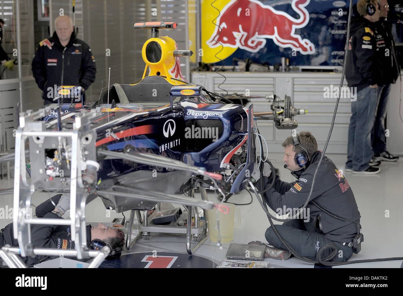 Mechanics build up the crashed car of German Formula One driver ...