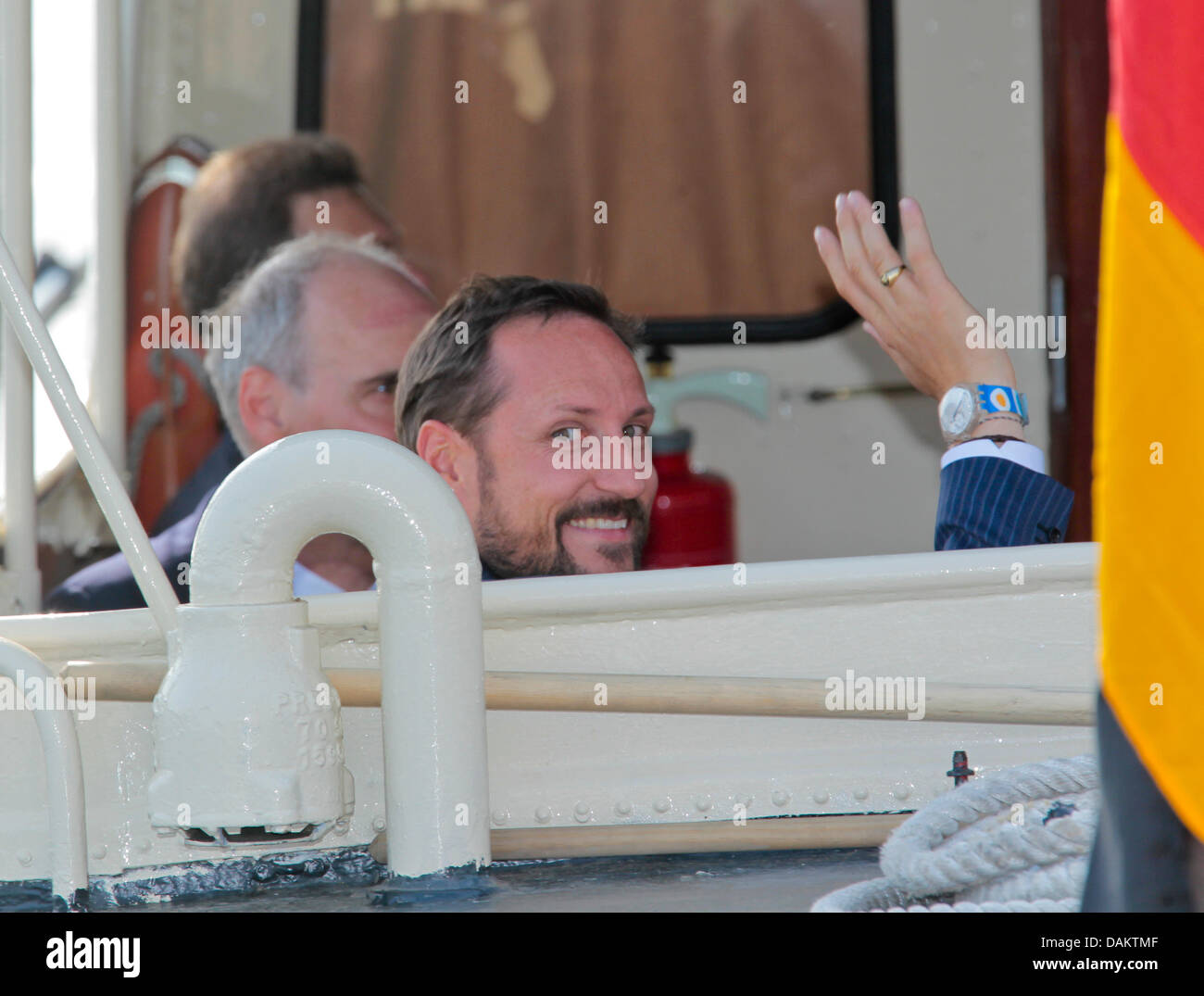 Norway's Crown Prince Haakon leaves the gangplank with a harbour launch ...