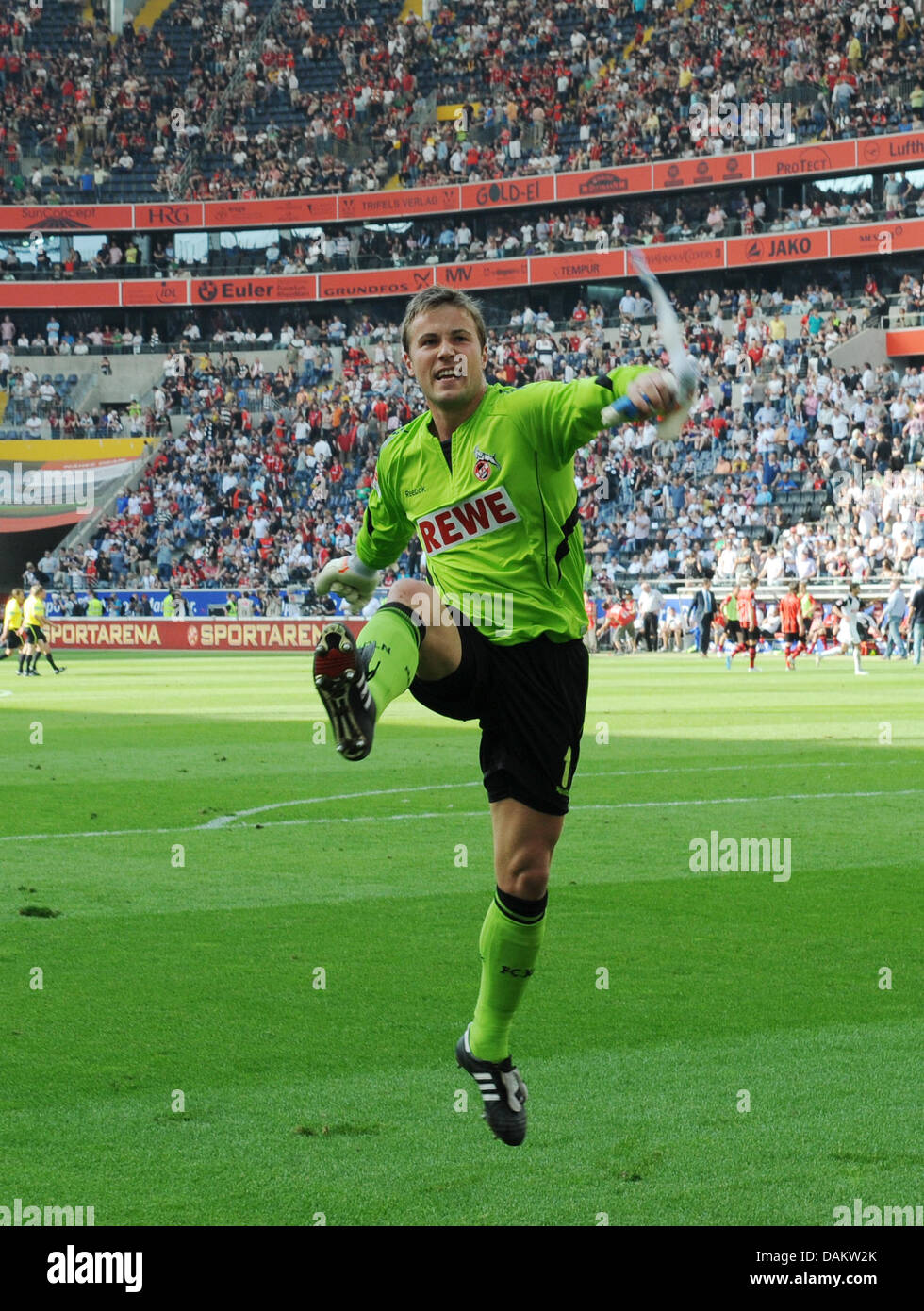 Cologne's goalkeeper Michael Rensing celebrates after the Bundesliga ...