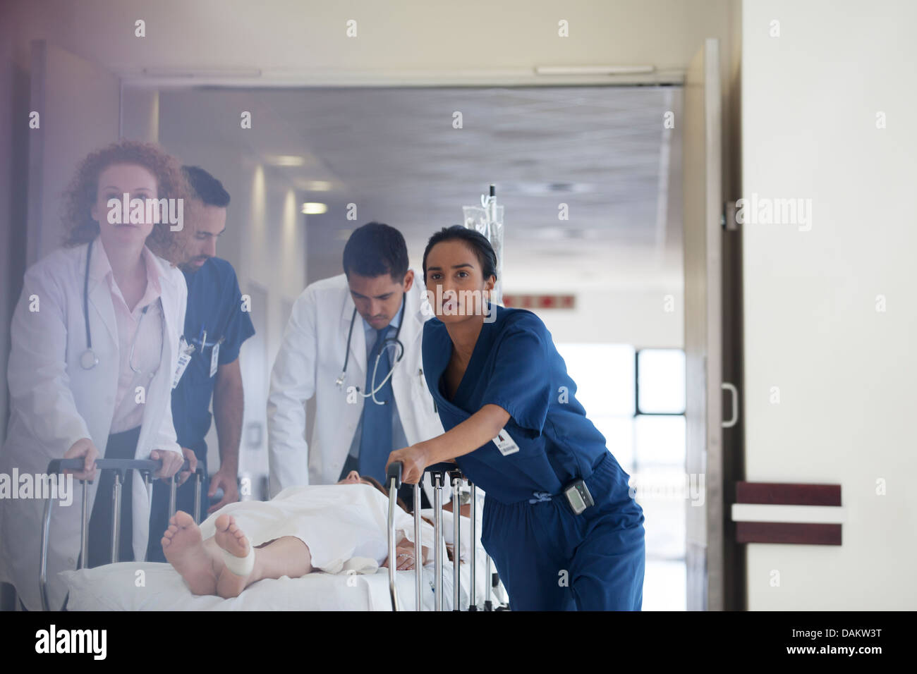 Hospital staff rushing patient to operating room Stock Photo - Alamy