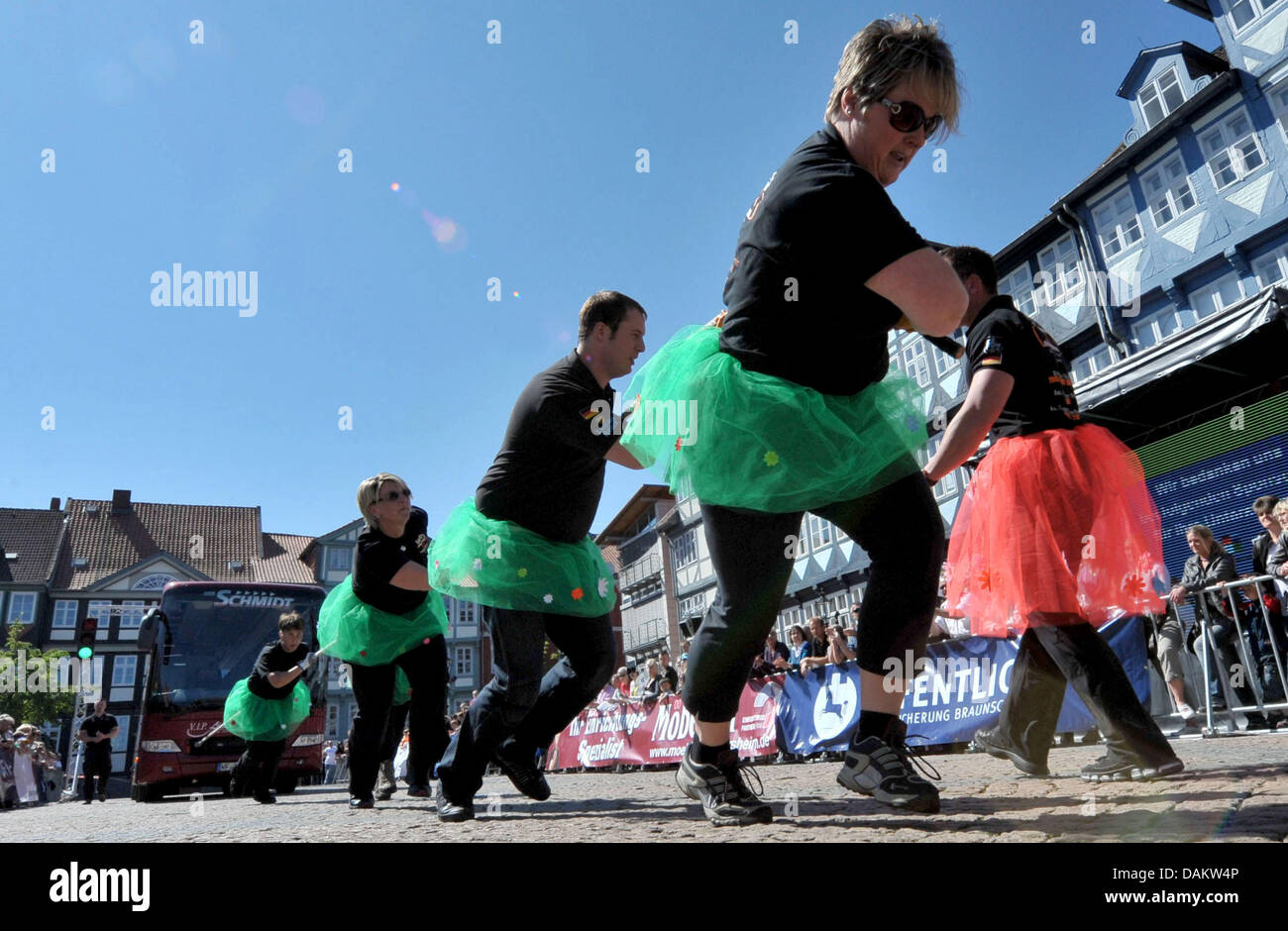 Participants of so called "bus pulling" pull a 16 ton heavy bus across ...