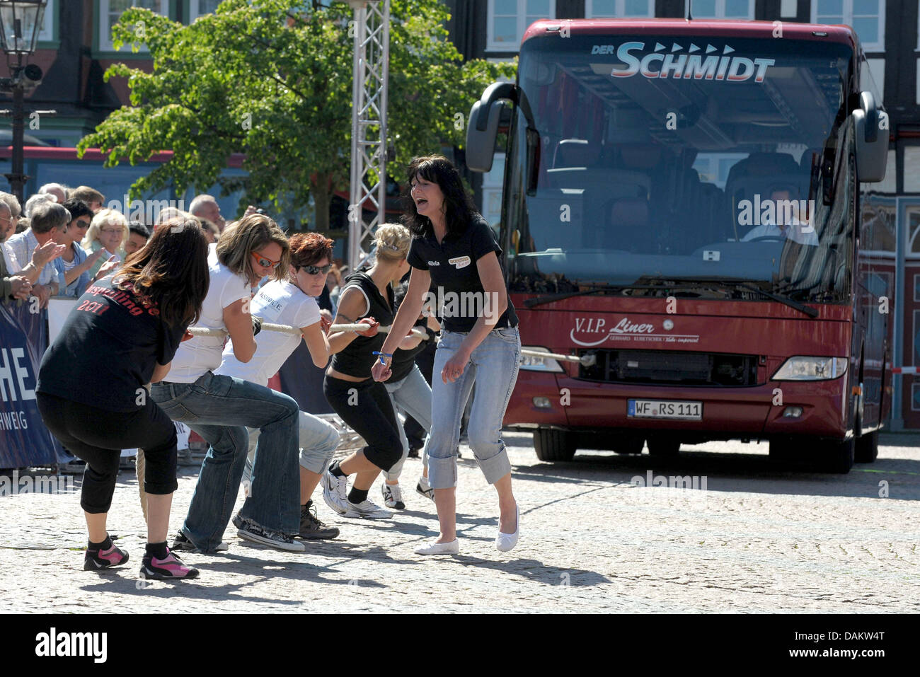 Participants of so called "bus pulling" pull a 16 ton heavy bus across ...