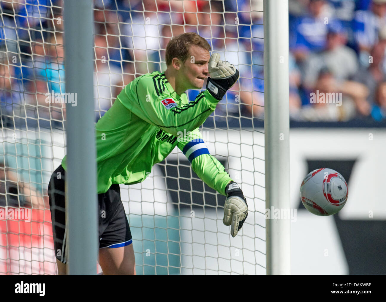 Schalke's keeper Manuel Neuer throws the ball out of the goal at the ...