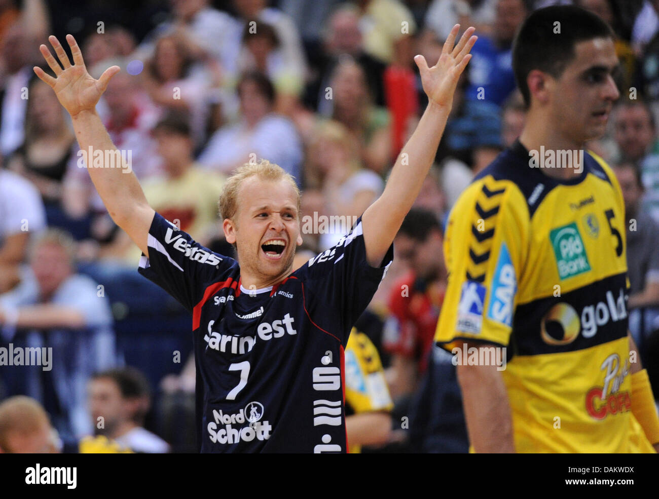 Flensburg's Andreas Eggert cheers about the triumph after the German ...