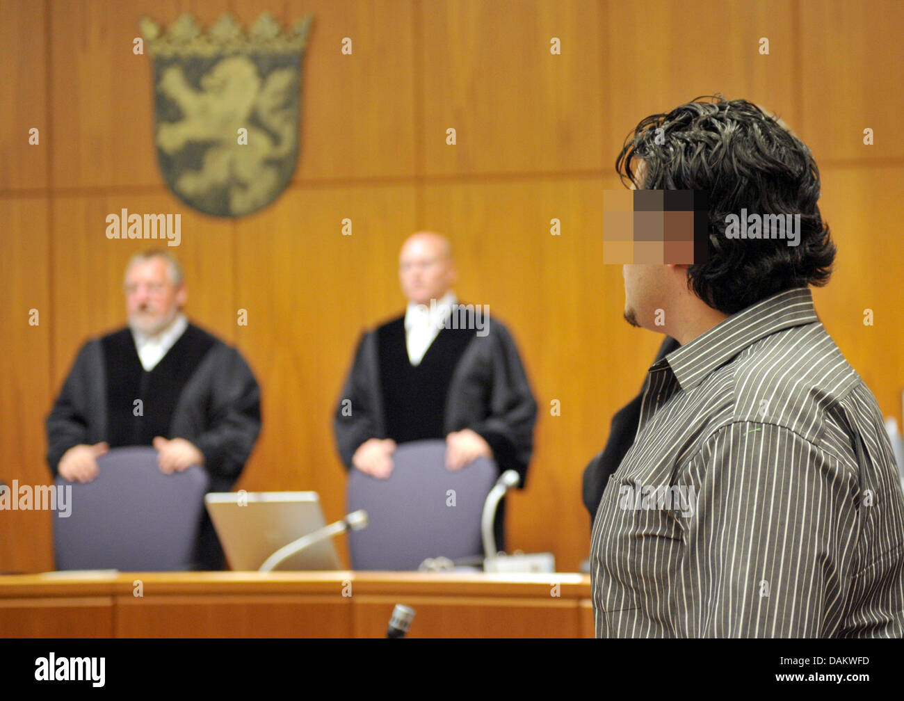 Al-Qaida member Rami M. (FRONT) stands up as the judges enter the court ...