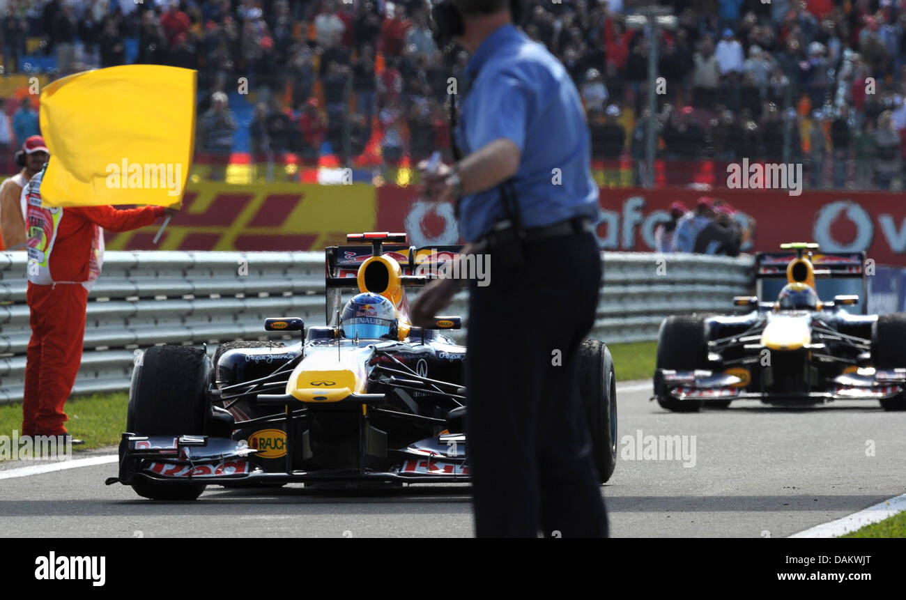 German Formula One driver Sebastian Vettel of Red Bull steers his car ...