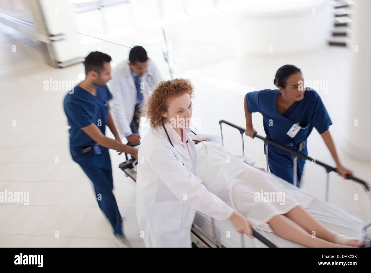 Hospital staff rushing patient to operating room Stock Photo - Alamy