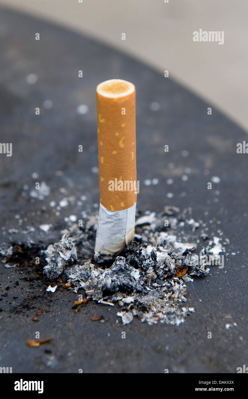 A cigarette is put out on the lid of a trash can in Berlin, Germany, 3 ...