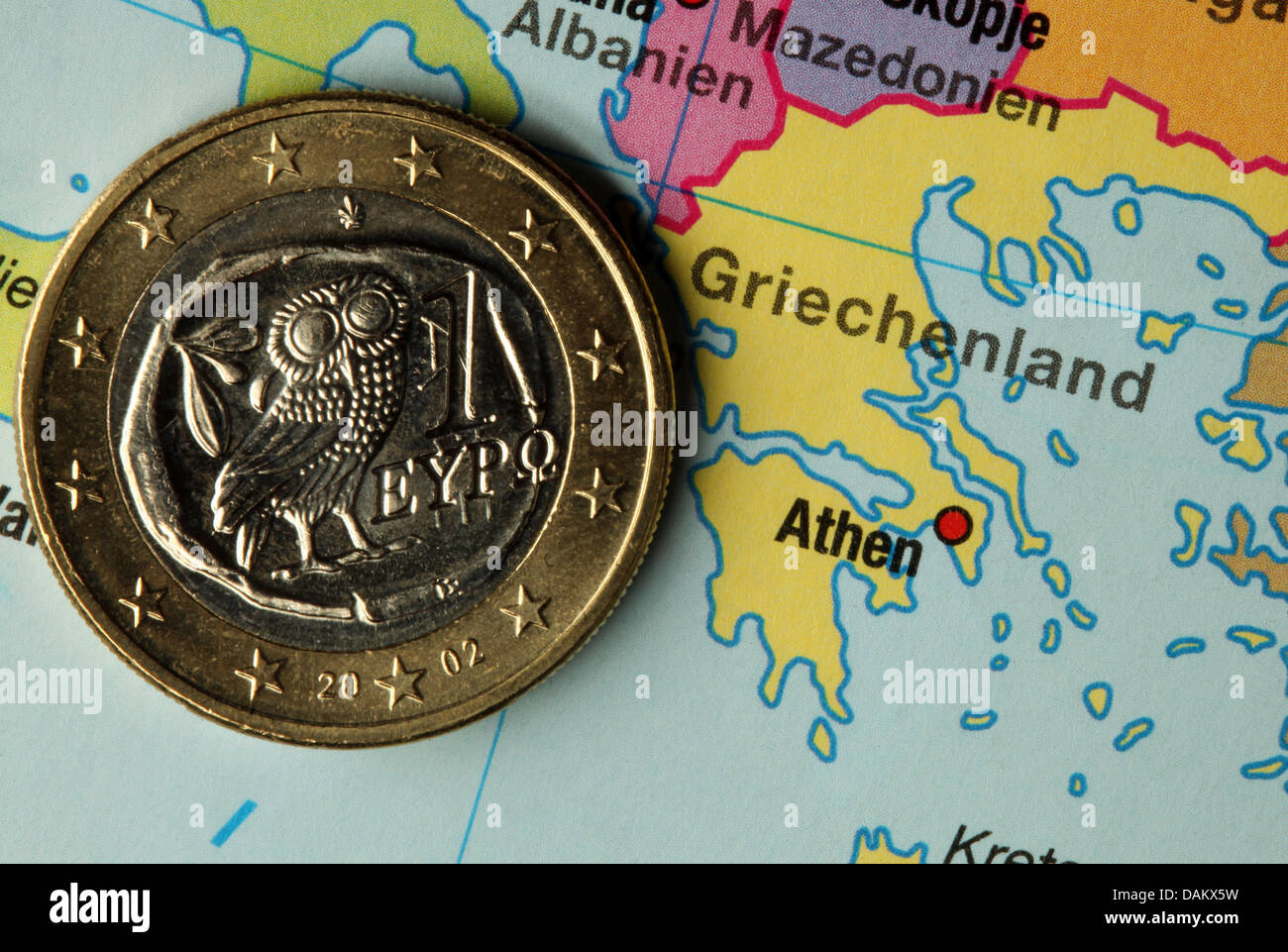 A Greek one-euro-coin lays on a map in Schwerin, Germany, 10 May 2011 ...